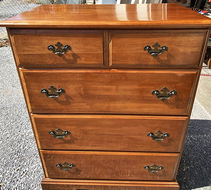 Behold, the Rolls-Royce of dressers! This maple masterpiece has more character than a Dickens novel and probably weighs about as much.