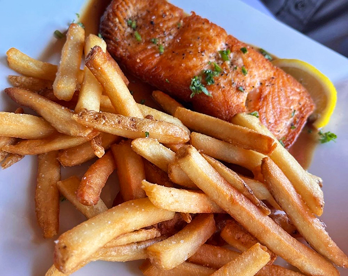 Perfectly grilled salmon with a golden crust, proving there's more to coastal cuisine than just lobster.