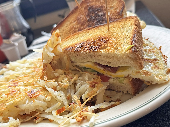 This isn't just a sandwich; it's a tower of toasty perfection. And those hash browns? Crispy enough to make a potato proud.