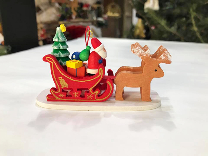 Santa's sleigh gets an upgrade! This miniature wooden scene captures the magic of Christmas, Southwest style. Rudolph, meet your new cactus friend! 