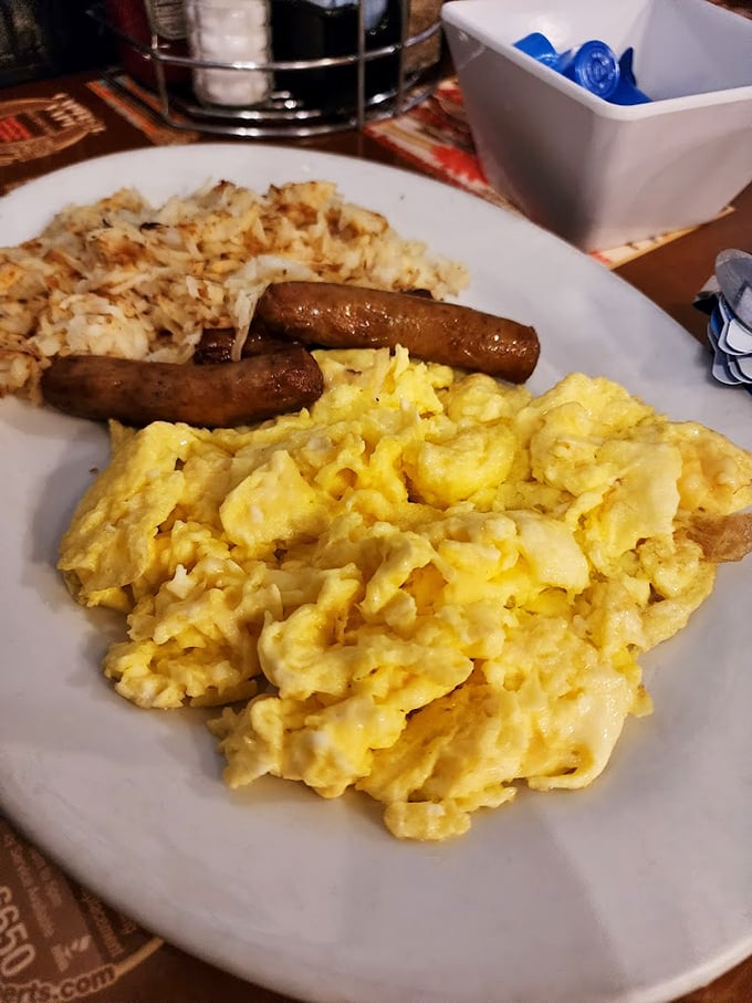 Fluffy scrambled eggs share the plate with savory sausage links, proving sometimes simple is simply perfect. Photo credit: Adventure_With_Purpose Tricia