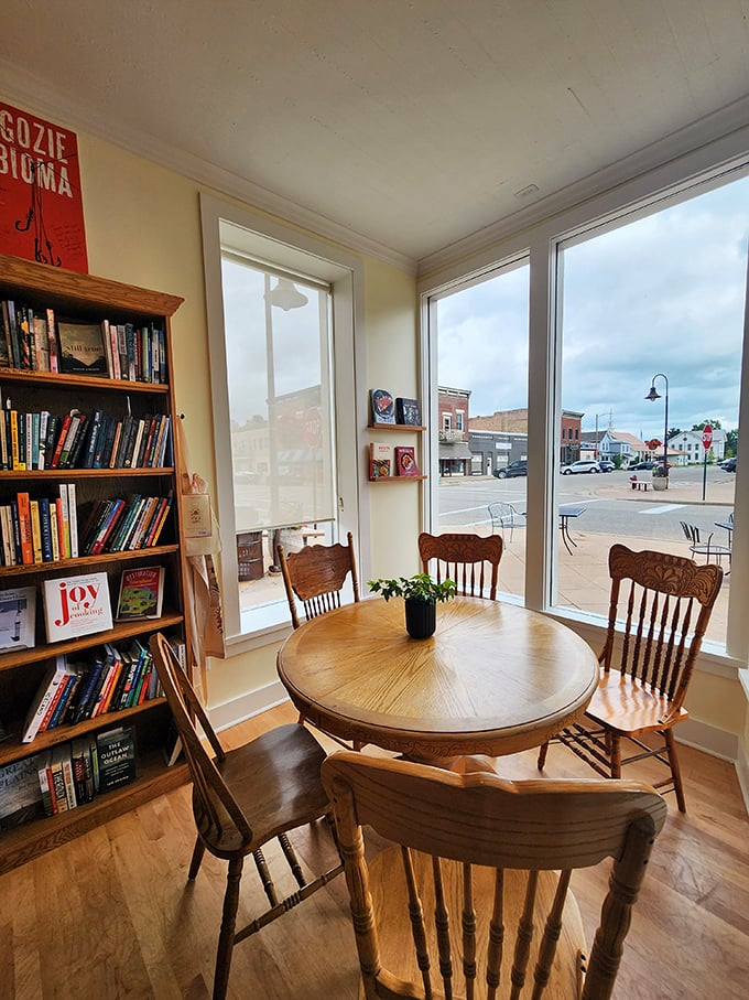 A cozy corner with a view! This charming nook is the perfect spot to lose yourself in a good book while keeping one eye on the bustling world outside. It's like people-watching, but with better company.