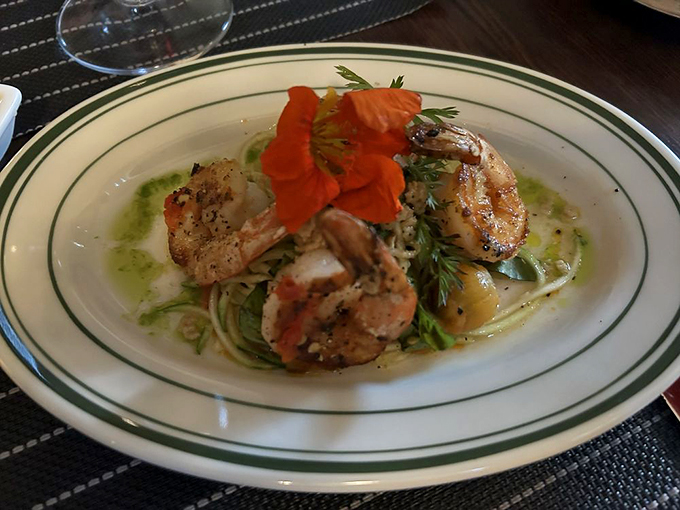 Shrimp so perfectly cooked, they're doing their best impression of butter-poached luxury, complete with an edible flower crown. Photo credit: Maria S.