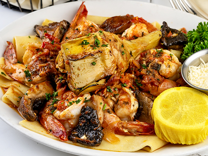 A pasta party with some VIP guests! These plump shrimp are living their best life, lounging in a hot tub of deliciousness.