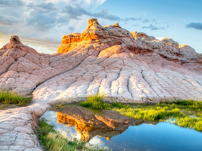 Mirror, mirror in the desert: Still waters create perfect reflections of these magnificent rock formations at golden hour.
