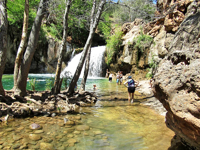 Summer's perfect playground unfolds at Fossil Creek, where waterfall mist meets desert sunshine.