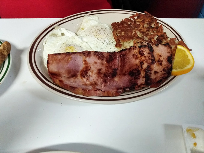 The breakfast trifecta: eggs, bacon, and hash browns. This plate is the morning equivalent of hitting the jackpot &ndash; no luck required, just a hearty appetite.