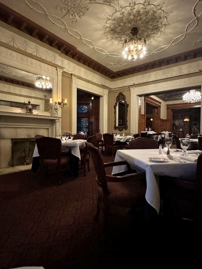 Candlelight and crystal chandeliers set the mood. Is this dinner or a scene from "Downton Abbey"?