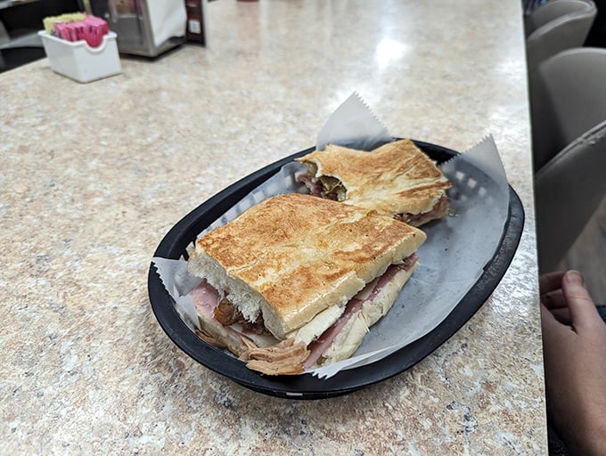 This Cuban sandwich isn't just a meal; it's a work of art. Da Vinci had his Mona Lisa; Cafe Caribe has this masterpiece. Photo credit: william bossom