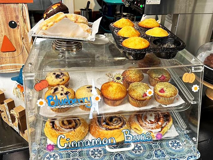 Behind this clear display case lies temptation in its purest form - homemade pastries that make willpower disappear.