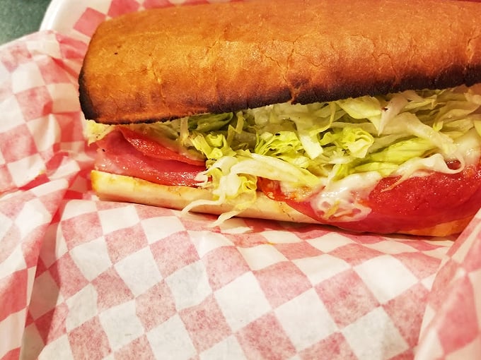 Sub-lime satisfaction guaranteed! This sandwich is stacked higher than your weekend to-do list, but infinitely more enjoyable.