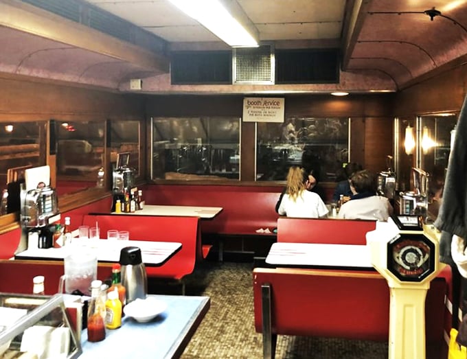 Red vinyl booths: Where dreams of juicy burgers and crispy fries come true. Also great for impromptu karaoke sessions.