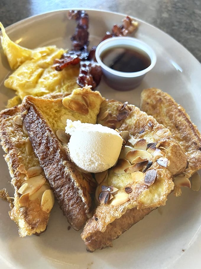 Almond French toast: because sometimes breakfast should feel like dessert. It's the morning indulgence that'll make you say, "Diet? What diet?" Photo credit: Miko I.