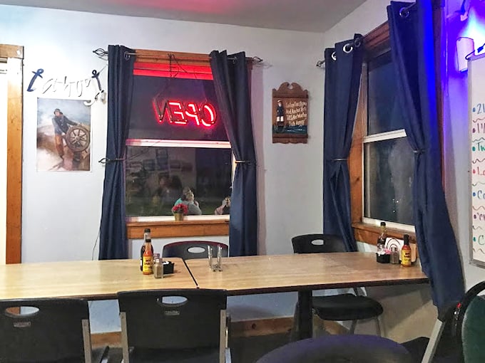 Evening light filters through navy curtains, creating the perfect setting for comfort food and conversation