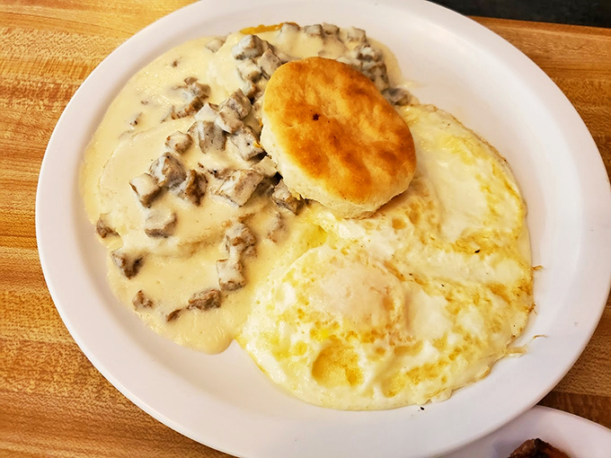 Country-style comfort meets diner charm in this classic plate of biscuits and gravy with sunny-side-up eggs.