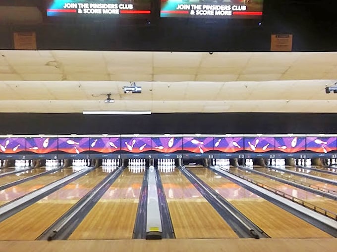 Clean lines and modern scoring systems blend seamlessly with traditional bowling lane design.