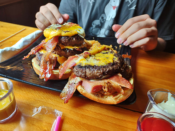Burger bliss! This towering creation is a testament to the art of stacking deliciousness.