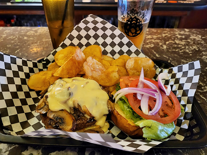 A burger that means business: Mushrooms, melted cheese, and all the fixings on a perfectly toasted bun.