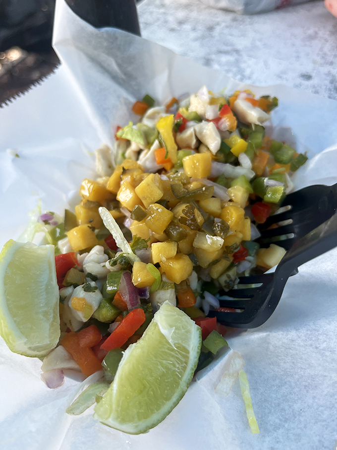A rainbow on a plate! This conch ceviche is a flavor fiesta, proving that sometimes the best things in life are served cold.
