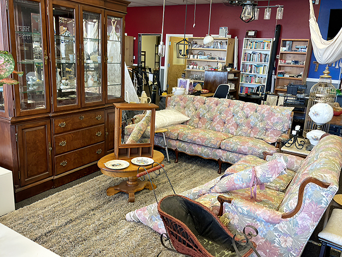 A floral-patterned living room set and classic china cabinet create an instant snapshot of timeless elegance.