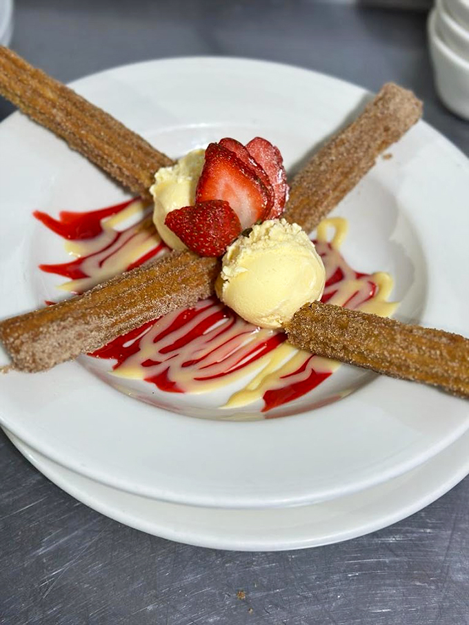 Churros meet ice cream in an artistic dessert presentation that's almost too pretty to eat. Almost. Photo credit: 5th Avenue Cafe