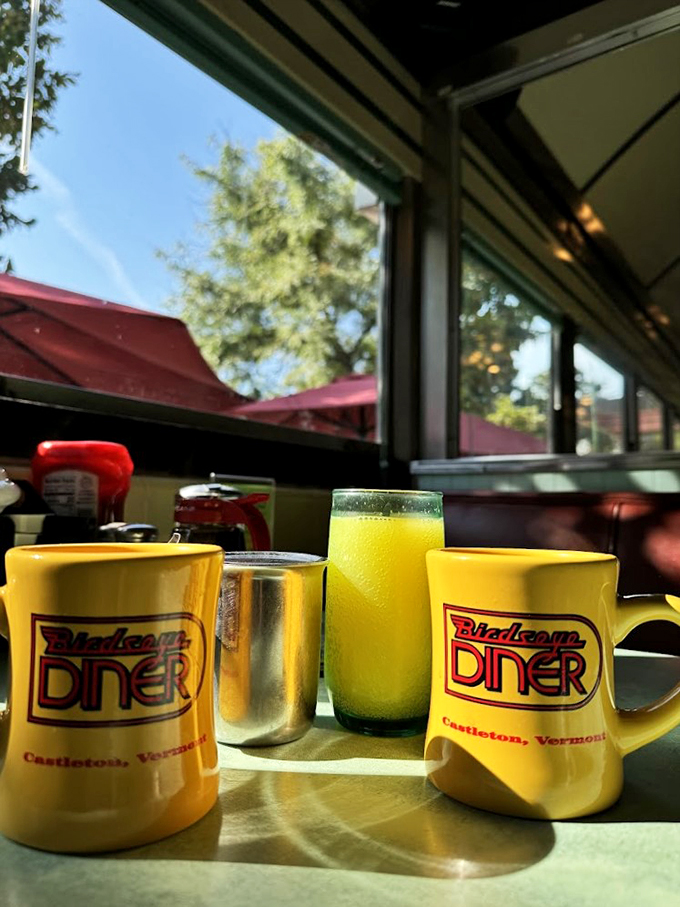 A rainbow of mugs and glasses, each promising its own flavor adventure. It's like a beverage block party!