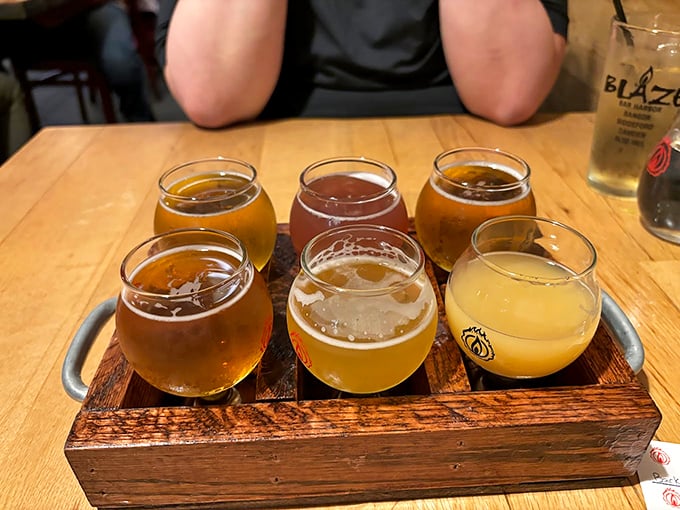 A flight of craft beers tells the story of Maine's brewing heritage, each glass offering a different chapter of flavor. Photo credit: L S