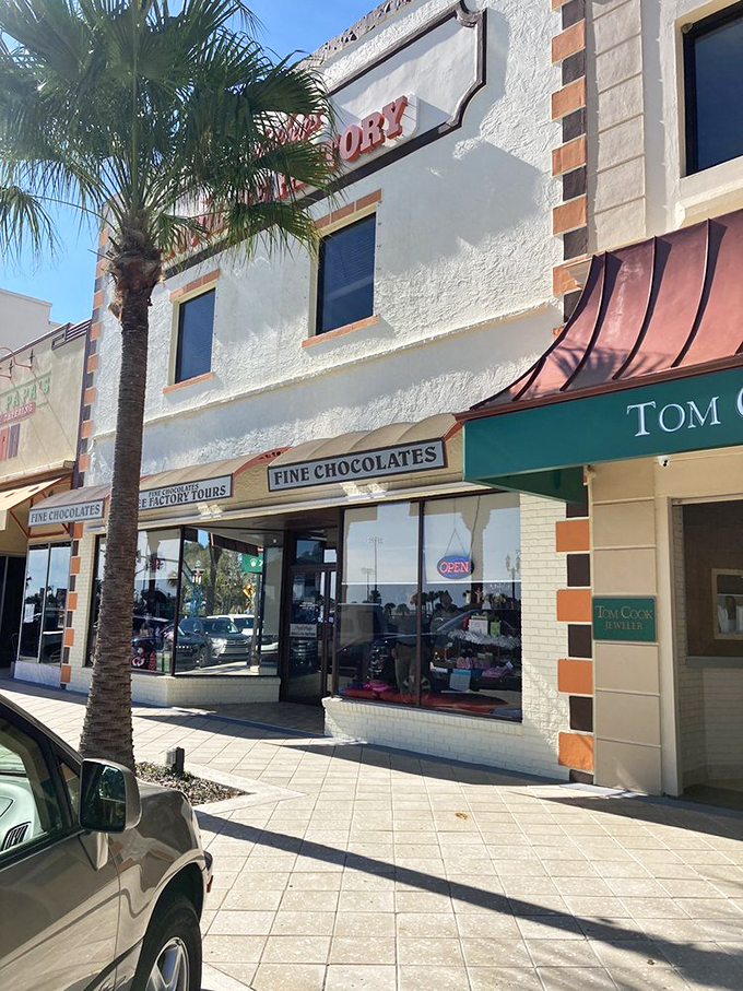 Exterior Different Angle Chocolate oasis in the Florida sun! This charming storefront is a beacon of sweetness amidst the palm trees and sunshine.