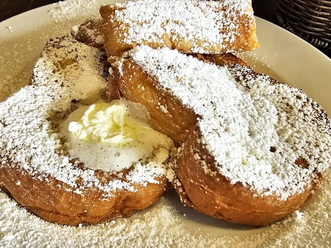 French toast that's powdered and pretty. It's like your breakfast got all dressed up for a fancy brunch date.