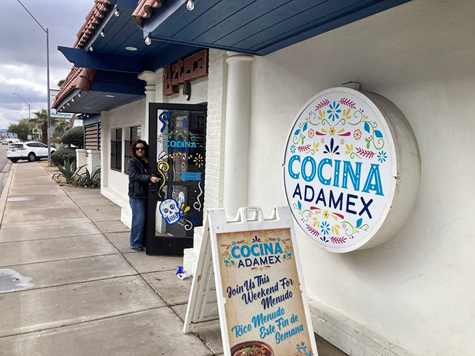 The storefront's playful signage promises weekend menudo - a beacon of hope for Sunday morning recovery seekers.