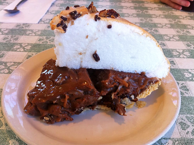 A slice of heaven with chocolate, coconut, and a cloud of whipped cream that would make angels jealous.
