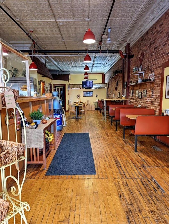 Wooden floors and brick walls tell stories of countless satisfied customers who've found their sandwich happiness here.