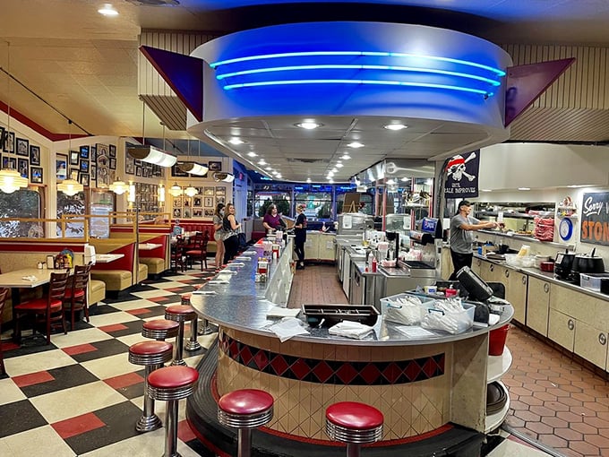 The heart of the Galaxy: where soda jerks once reigned supreme. This gleaming counter is your front-row seat to culinary time travel.