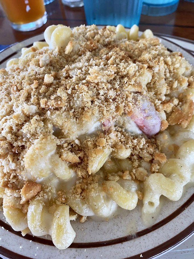 Mac and cheese gets dressed up for a fancy night out, donning a seafood tuxedo and breadcrumb bow tie.
