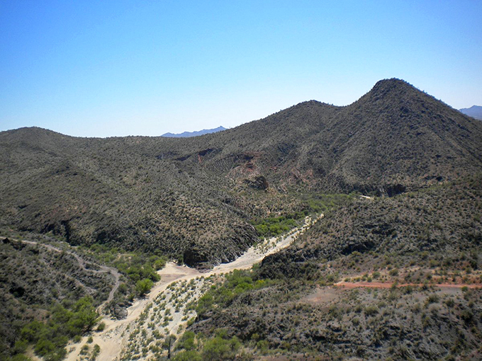 Mountains that could make a geologist weep with joy. It's like Mother Nature decided to show off her sculpting skills in the Arizona heat.