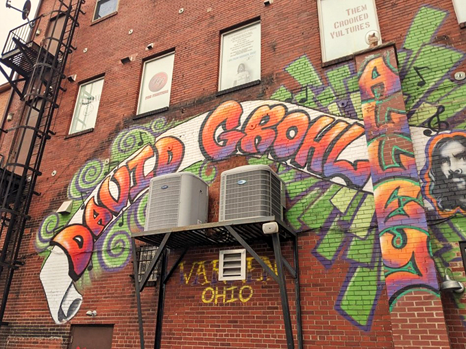 Grohl's gaze in graffiti glory! This close-up mural captures the intensity of a rock god mid-performance. Can you hear the crowd roar?