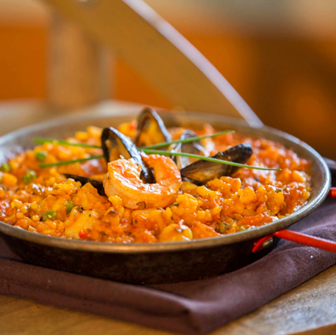 A symphony of seafood and saffron rice, with mussels and shrimp playing the starring roles in this Spanish classic.