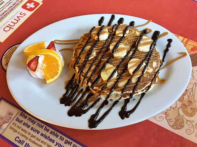 These pancakes, drizzled with chocolate and caramel, turn breakfast into an excuse for dessert. Photo credit: 5th Avenue Cafe