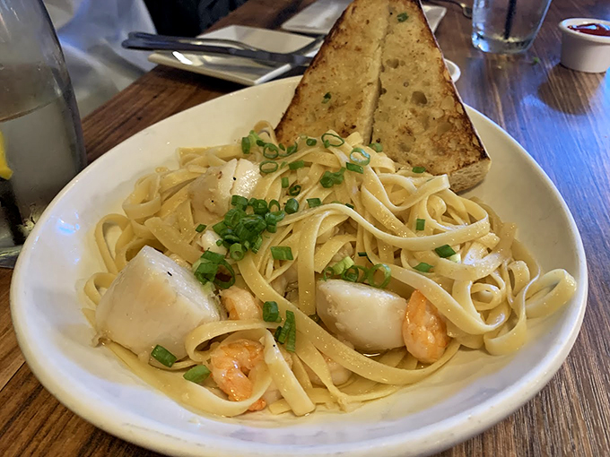 Fettuccine with seafood, where each tender noodle dances with delicate morsels of the sea. 