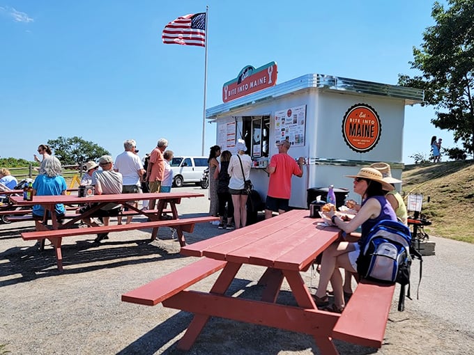 Red picnic tables under blue skies&mdash;where memories are made one lobster roll at a time. Photo credit: Ken Rodriguez (Krgplaces)