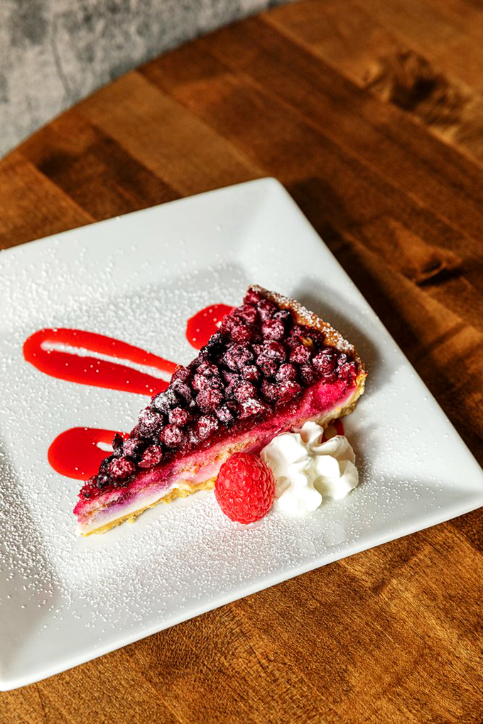 This raspberry tart isn't just dessert - it's edible art with a perfect balance of sweet and tart.