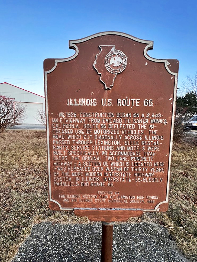 A historic marker tells the tale of America's Mother Road, setting the stage for this modern roadside attraction.