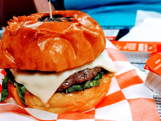 This cheeseburger isn't trying to compete with the seafood - it's confidently doing its own delicious thing.