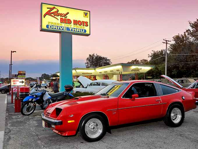 Against the sunset sky, that illuminated sign becomes a lighthouse guiding hungry souls to hot dog heaven.