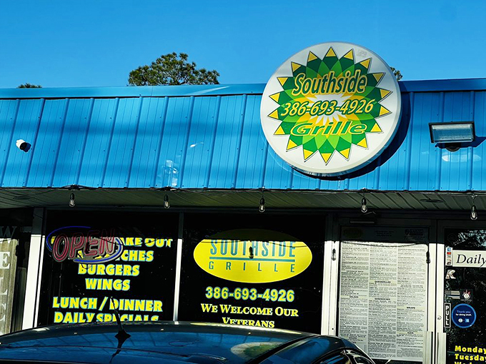 The sunburst logo shines bright against Florida's blue sky, promising good food and warm welcomes inside.