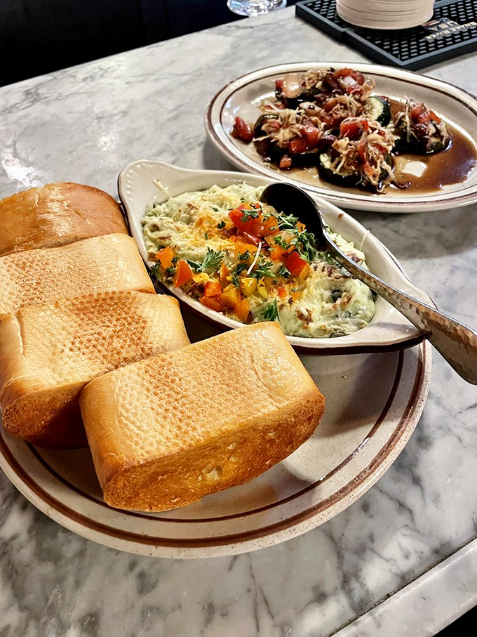 This spinach and artichoke dip is creamier than a country love song. And that Texas toast? It's the perfect dance partner. Photo credit: Doc F.