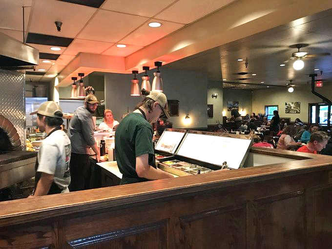 The dream team at work! These culinary wizards are like the Avengers of comfort food, assembling deliciousness one plate at a time. Photo credit: Photo credit: Dora H.