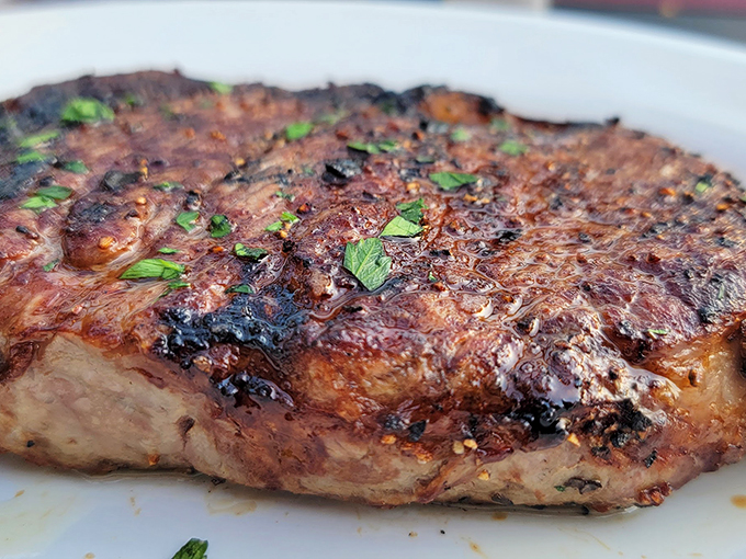 This steak isn't just cooked - it's been treated with the respect and care usually reserved for fine art. Photo credit: maverick42a