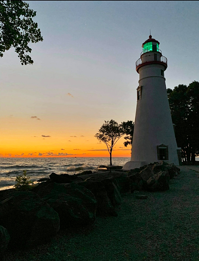 Sunset spectacular! The lighthouse silhouette creates a scene so perfect, it's like Mother Nature's own Instagram filter.