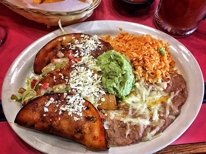 Grilled plantains add a sweet twist to this traditional plate, paired perfectly with Mexican rice and refried beans.